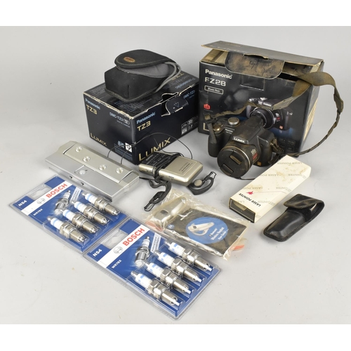 A Box Containing Cameras, Laser Pointer, Spark Plugs and Other Sundries