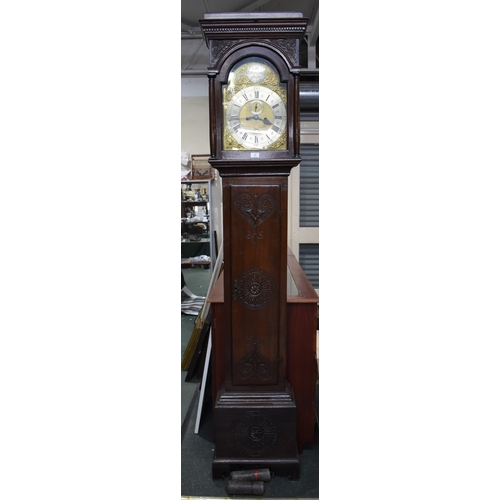A Tall Oak Long Case Clock with Carved Pendulum Door and Arched Dial ...