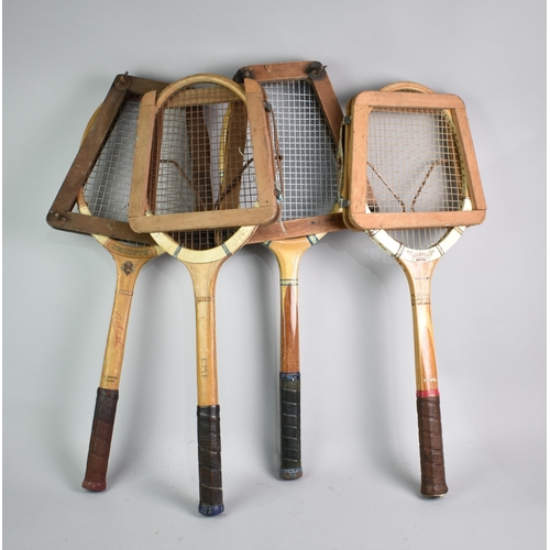 A Collection of Four Vintage Tennis Rackets