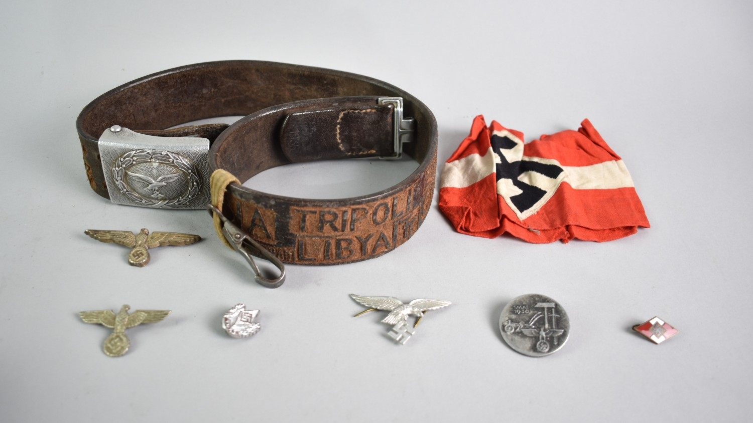 A Collection of WWII Nazi Badges, Belt and Armbands, Belt Carved with ...