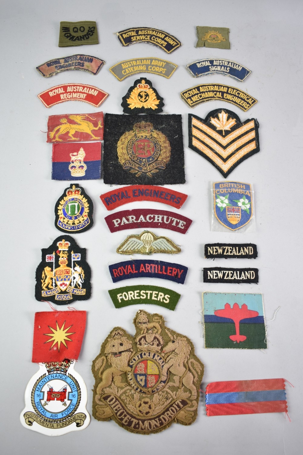A Collection of Vintage and Later Cloth Military Badges and Stripes