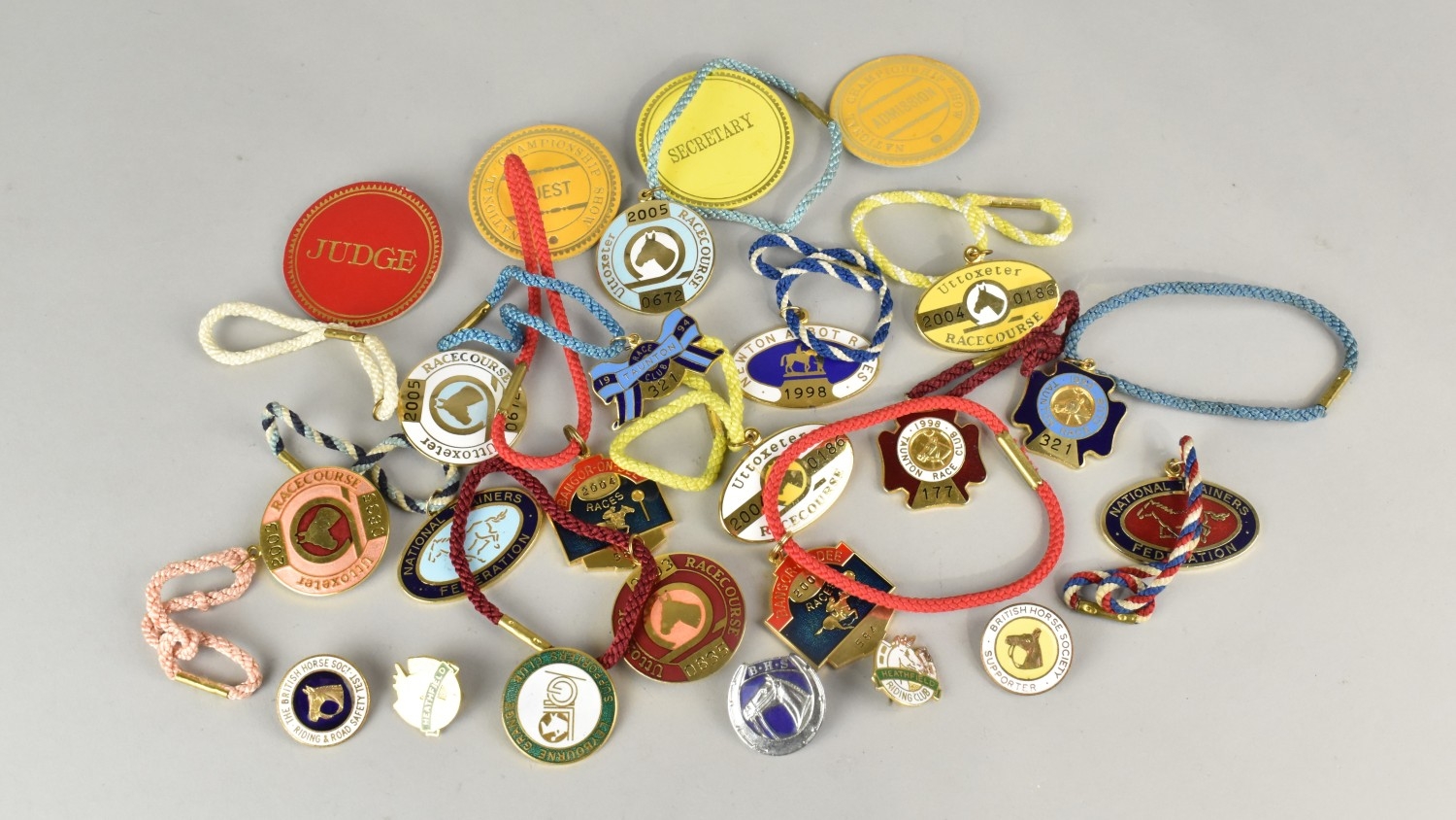 A Collection of Enamelled and Cardboard Racecourse Badges Etc