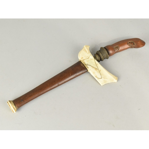A Far Eastern Kris Dagger with Rib Bone Guard and Carved Wooden Handle ...
