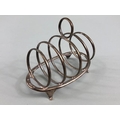 Hallmarked silver toast rack with graduated circular dividers on oval ...