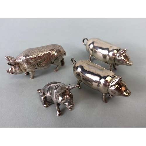 A pair of silver (925) vesta pigs with sprung loaded heads, a seated ...