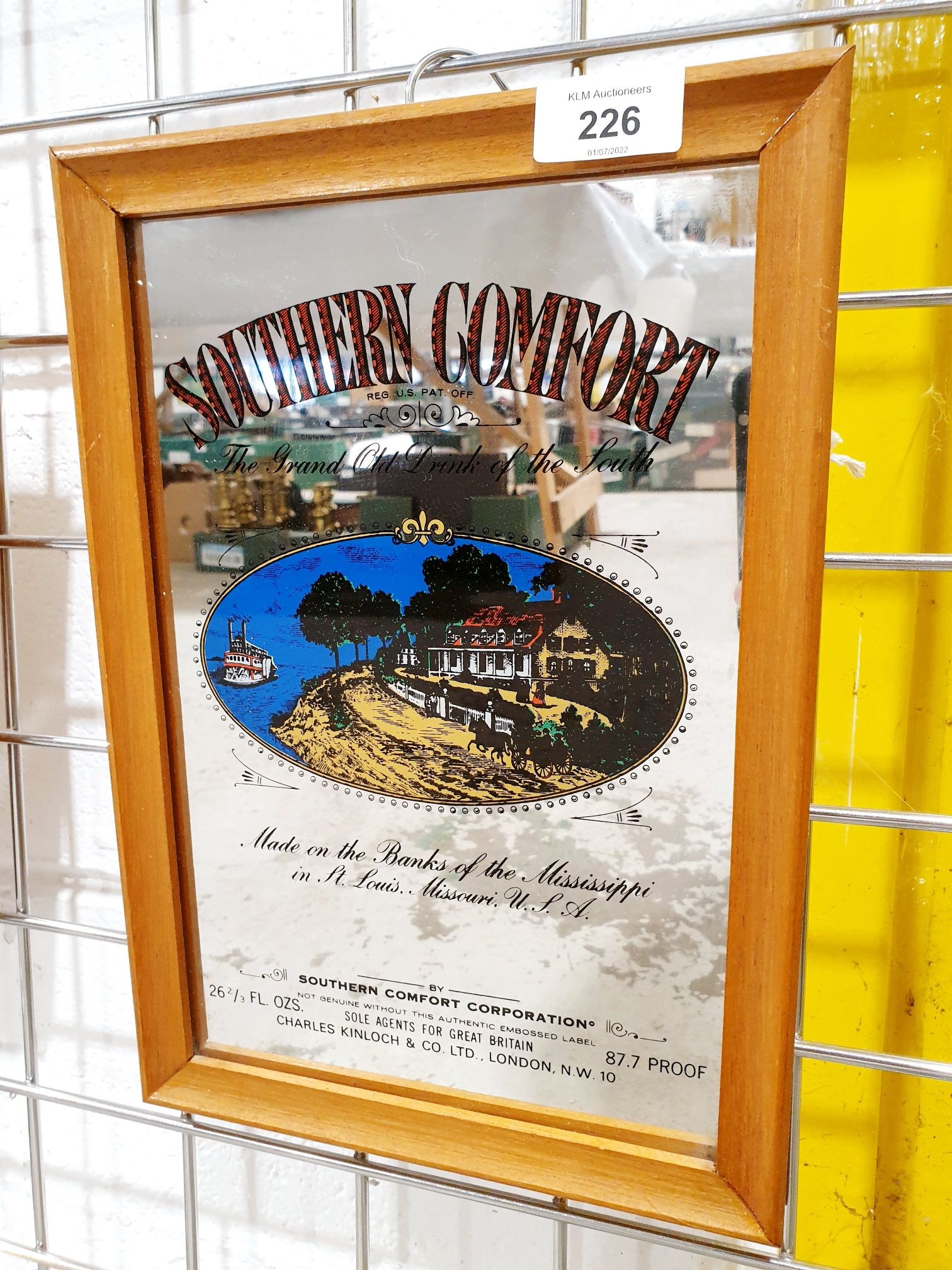 A Southern Comfort advertising mirror, 12"x8". No shipping. Arrange ...