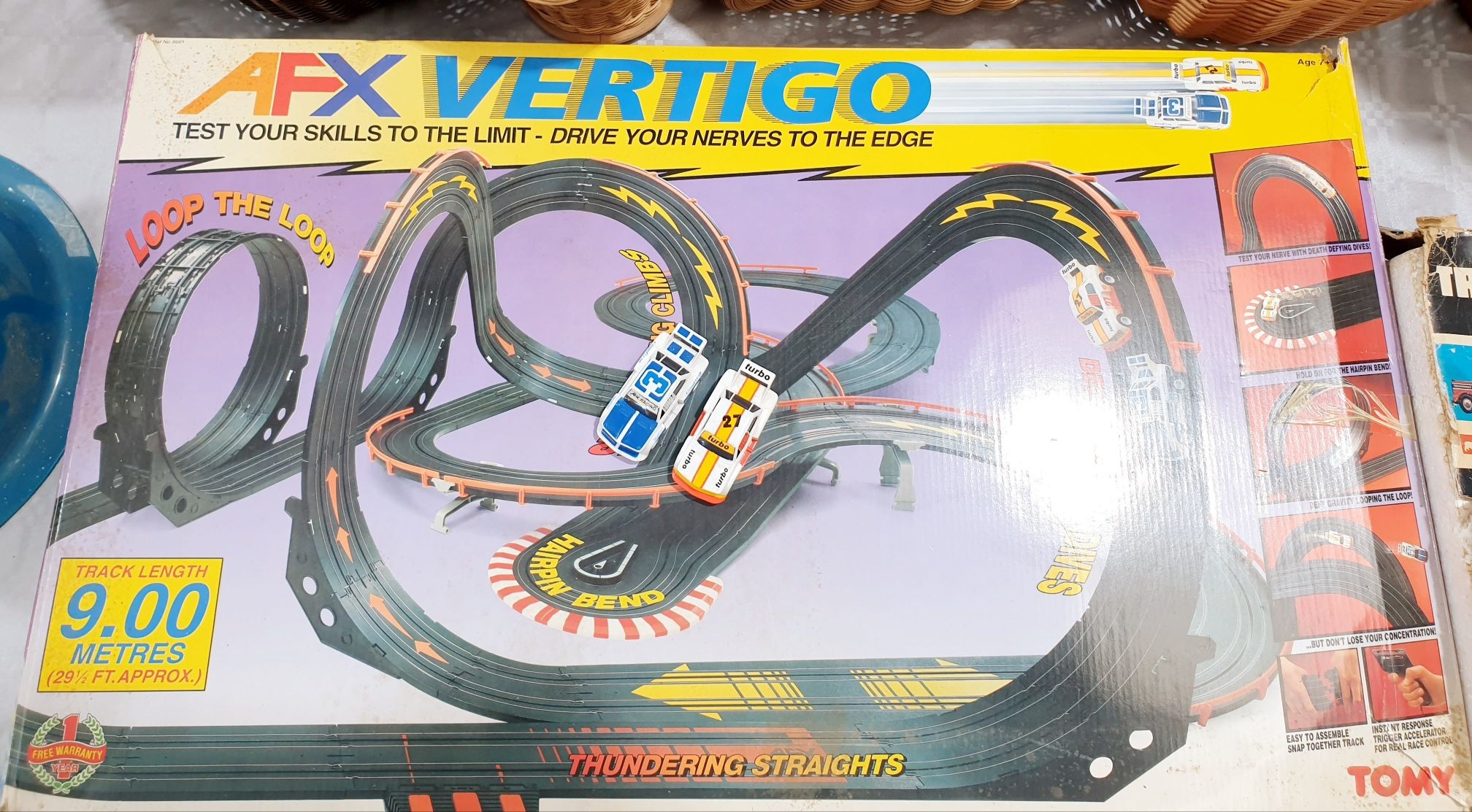 A Tomy AFX Vertigo slot car racing set together with a vintage boxed ...