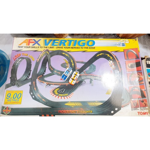 A Tomy AFX Vertigo slot car racing set together with a vintage boxed ...