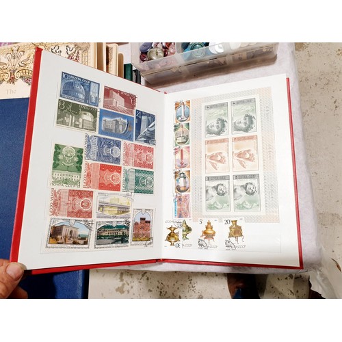 Three stamp albums of Russian stamps. UK shipping £14.