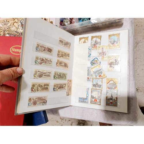 Three stamp albums of Russian stamps. UK shipping £14.