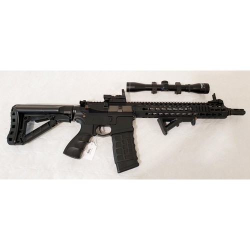 A Combat Machine air soft machine gun with dot sight and a scope. No ...