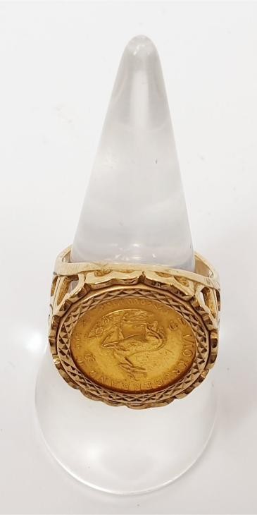 A hallmarked 9ct gold ring set with a 1/100oz Kruger Rand, 1985, gross ...