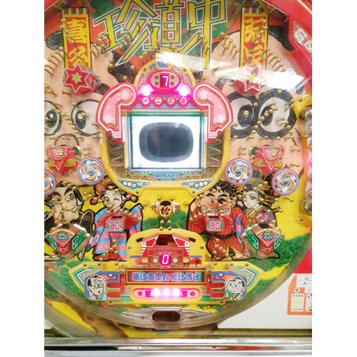 A vintage Japanese Pachinko machine, length 80cm, with transformer. No ...