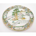 An antique Chinese Familie Vert plate decorated with ladies gaming at a ...