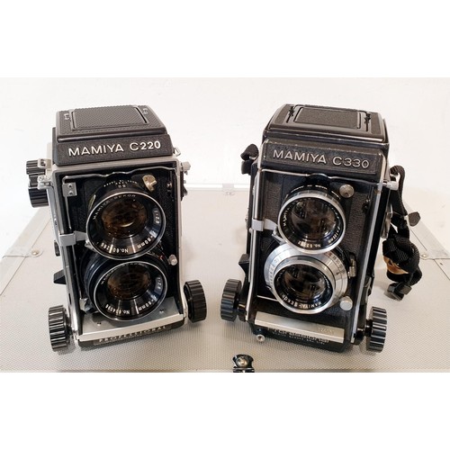 A selection of vintage Mamiya camera equipment to include: C220 and ...