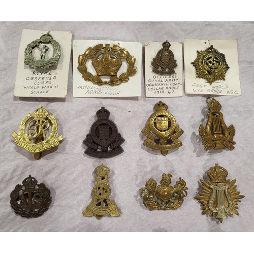 Twenty one British military cap badges and shoulder pips including ...