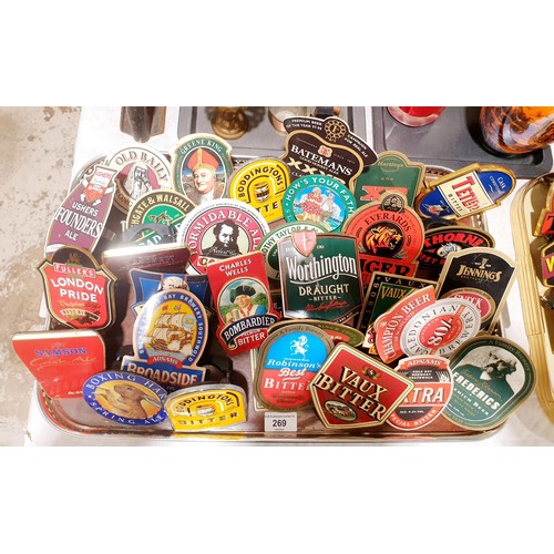 A tray of beer pump clip badges. UK shipping £14.