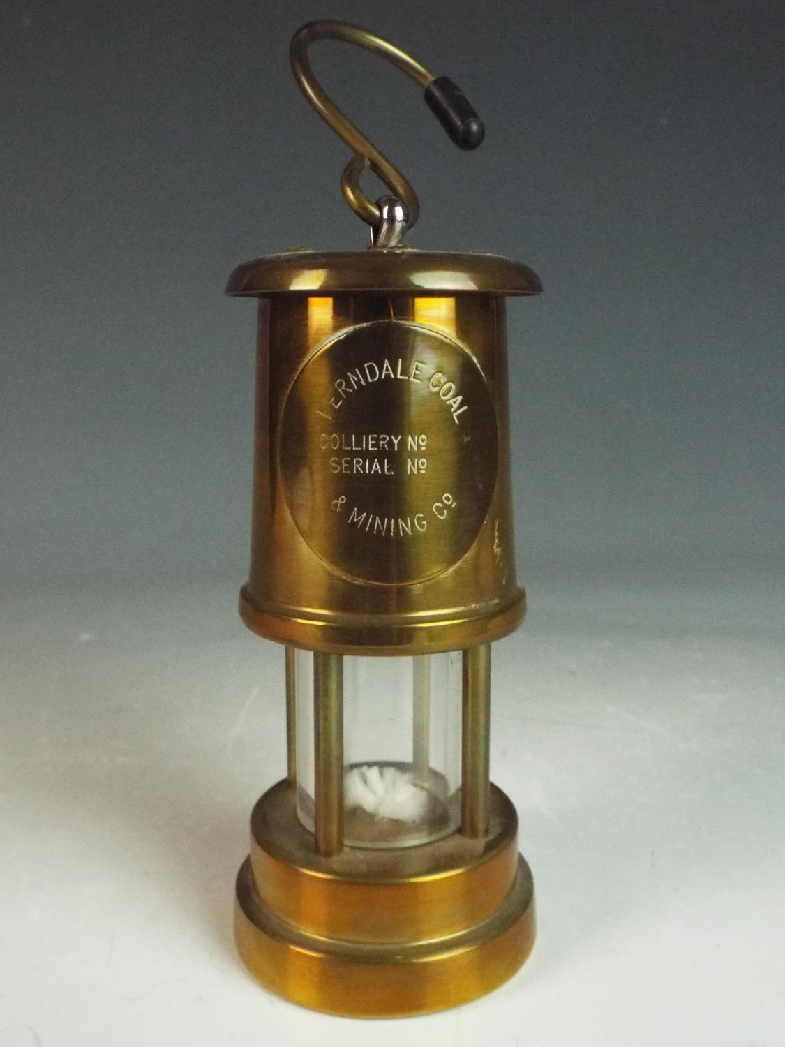 Decorative miniature miners lamp 5 inches tall.