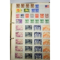 Three nicely presented, full international stamp albums, some mint stamps