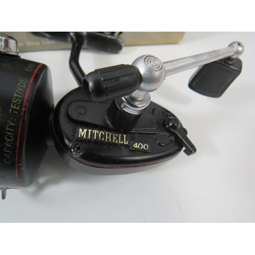 Mitchell 400 fishing reel and a bait indicator.
