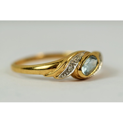 9ct Ring set with a Central Aqua with Multi Diamond set waves to each ...