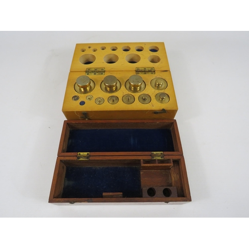 Boxed set of metric brass weights (smallest weight missing) plus a ...