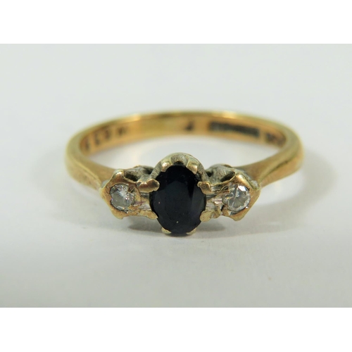 9ct Yellow Gold ring set with a Central Sapphire and flanked by two ...