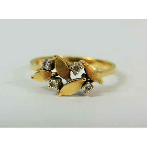 418ct Yellow Gold Ring with leaf decoration as set with four Melee ...