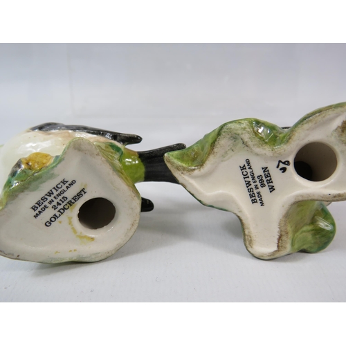 4 Beswick bird figurines.