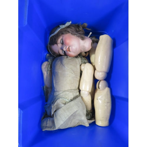 Vintage German composite doll with porcelain head in need of restoration.