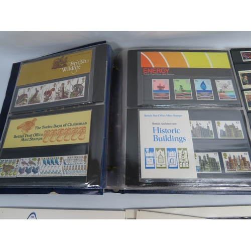 Album of GB mint stamp set plus Seven Usa mint stamp sets.