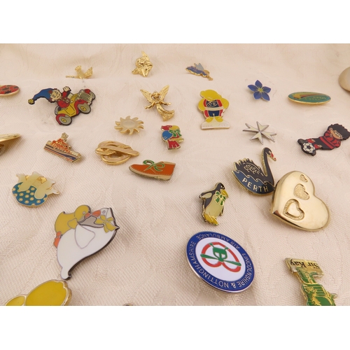Collection of novelty and enamel pin badges