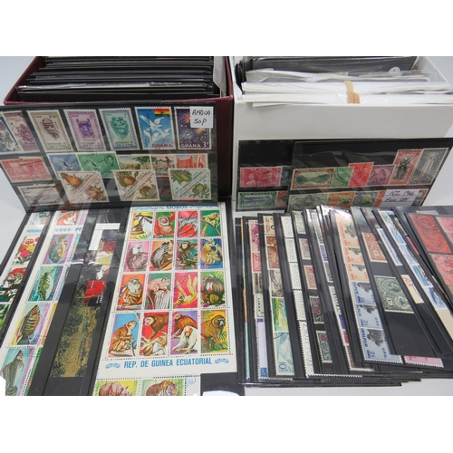 Box of stamp album pages with various world stamps