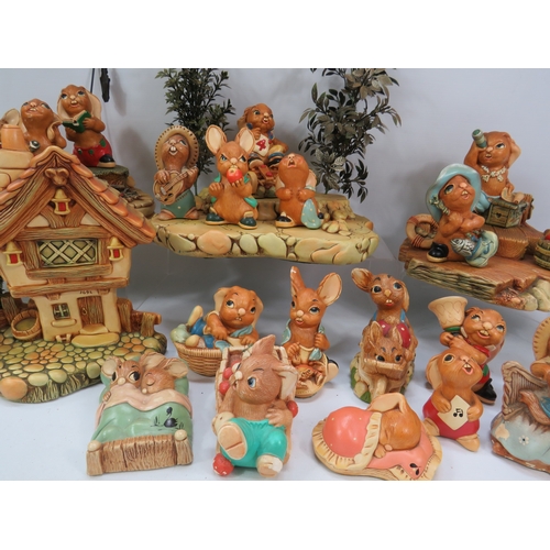 Collection of Pendelfin rabbit figurines with bases