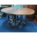 Georgian Oak Gatefold Table, oval top above baluster-turned supports ...