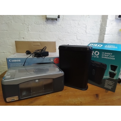 Canon hp printer and pro action strip cut paper shredder. Comes in ...