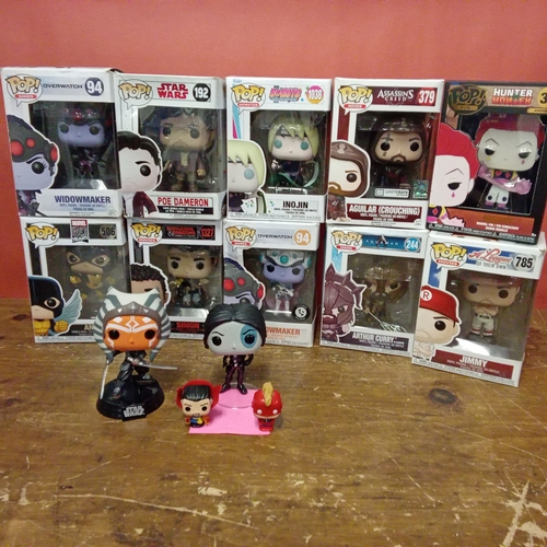Mixed collection of funko pops and smaller figures.