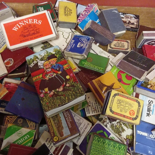 Large collection of vintage match boxes with matches.