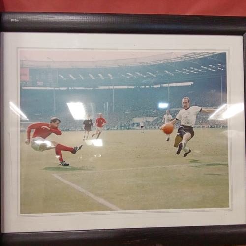 Framed image showing Geoff Hurst scoring a goal for England against ...