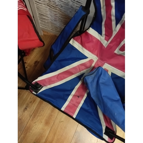 Two camping chairs with flag design.