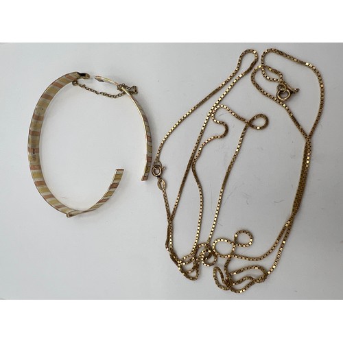 Two yellow metal chains marked 10k plus a 9ct gold tri-colour bangle a ...