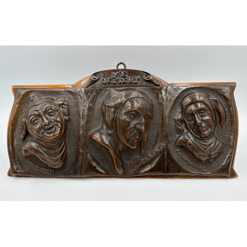 An Arts and Crafts copper relief moulded plaque, 'Y'e Jesters ...