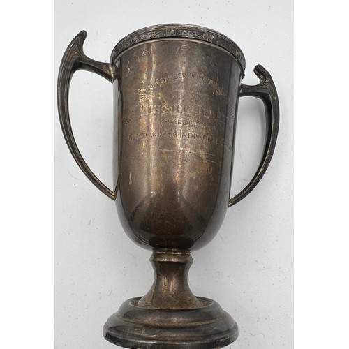 A hallmarked silver trophy on stand. Weight of trophy ? Height 14.5cm ...