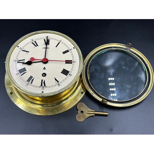 A vintage military bulkhead brass 8 day ships clock made by F.W. Elliot ...