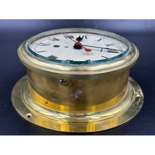 A vintage military bulkhead brass 8 day ships clock made by F.W. Elliot ...