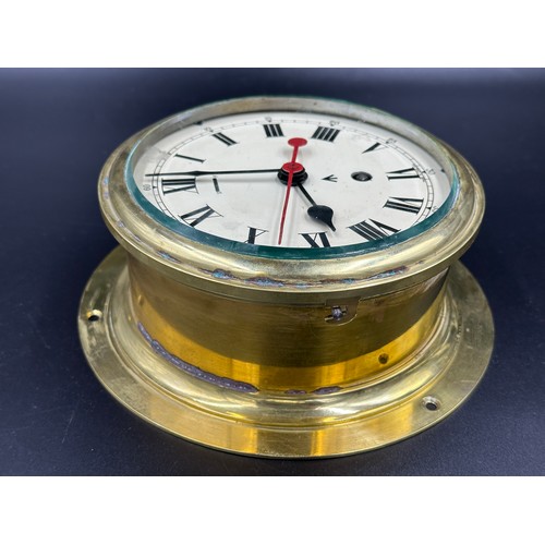 A vintage military bulkhead brass 8 day ships clock made by F.W. Elliot ...