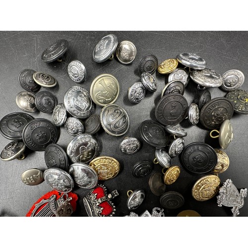 An assortment of Police helmet, cap badges and buttons. Large Police ...