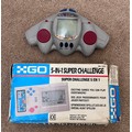 A Go 5-in-1 super challenge handheld game console together with a ...