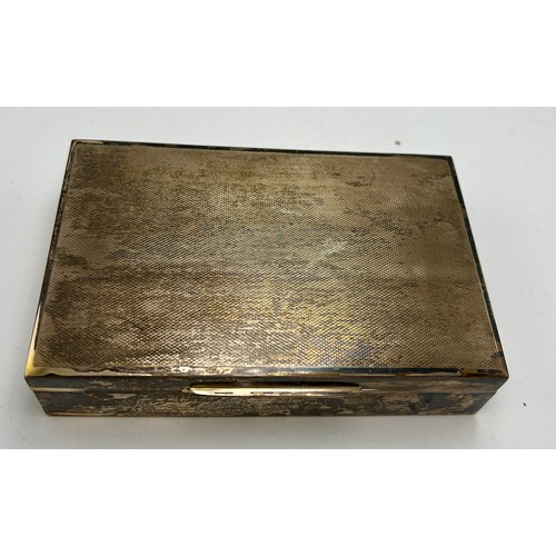 A hallmarked silver cigarette box Sheffield 1935, maker Walker & Hall ...