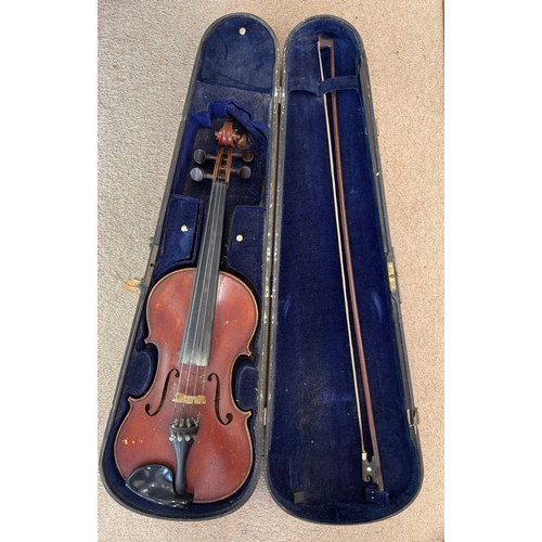 A wooden cased violin and bow. Violin labelled Patrick G. Milne Maker ...